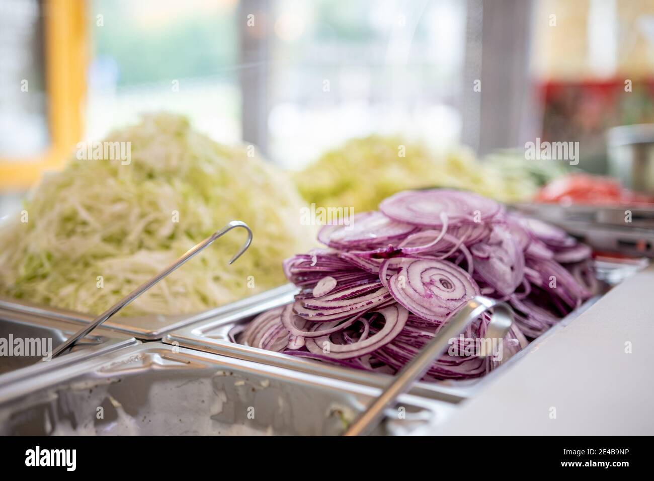 Vegetable counter at a local pizza and gyros restaurant Stock Photo - Alamy