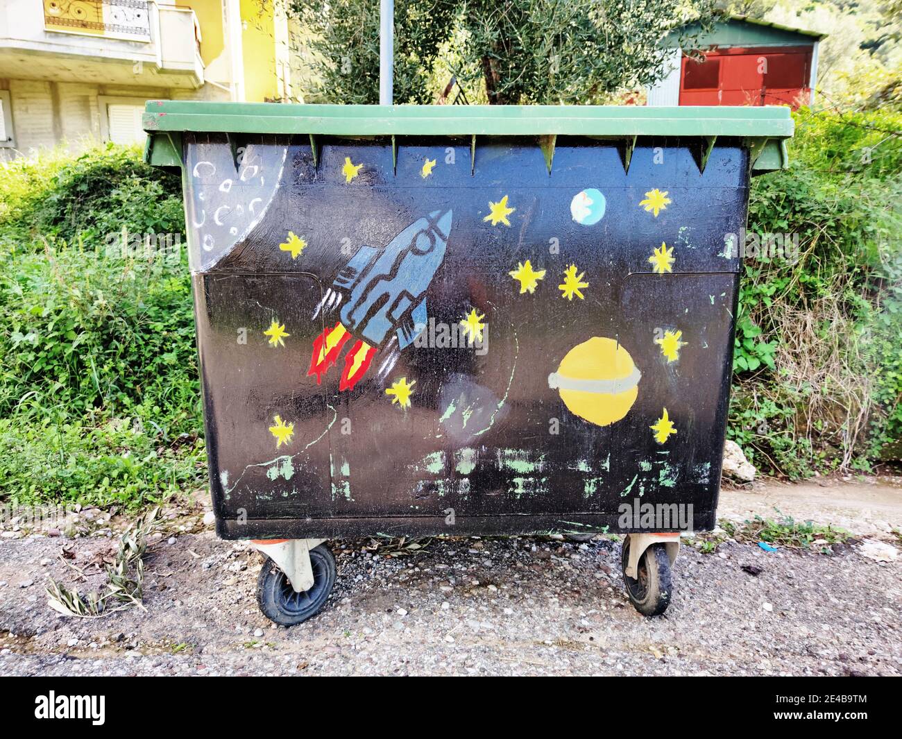 Rubbish bins brightly painted by school children in the small village ...