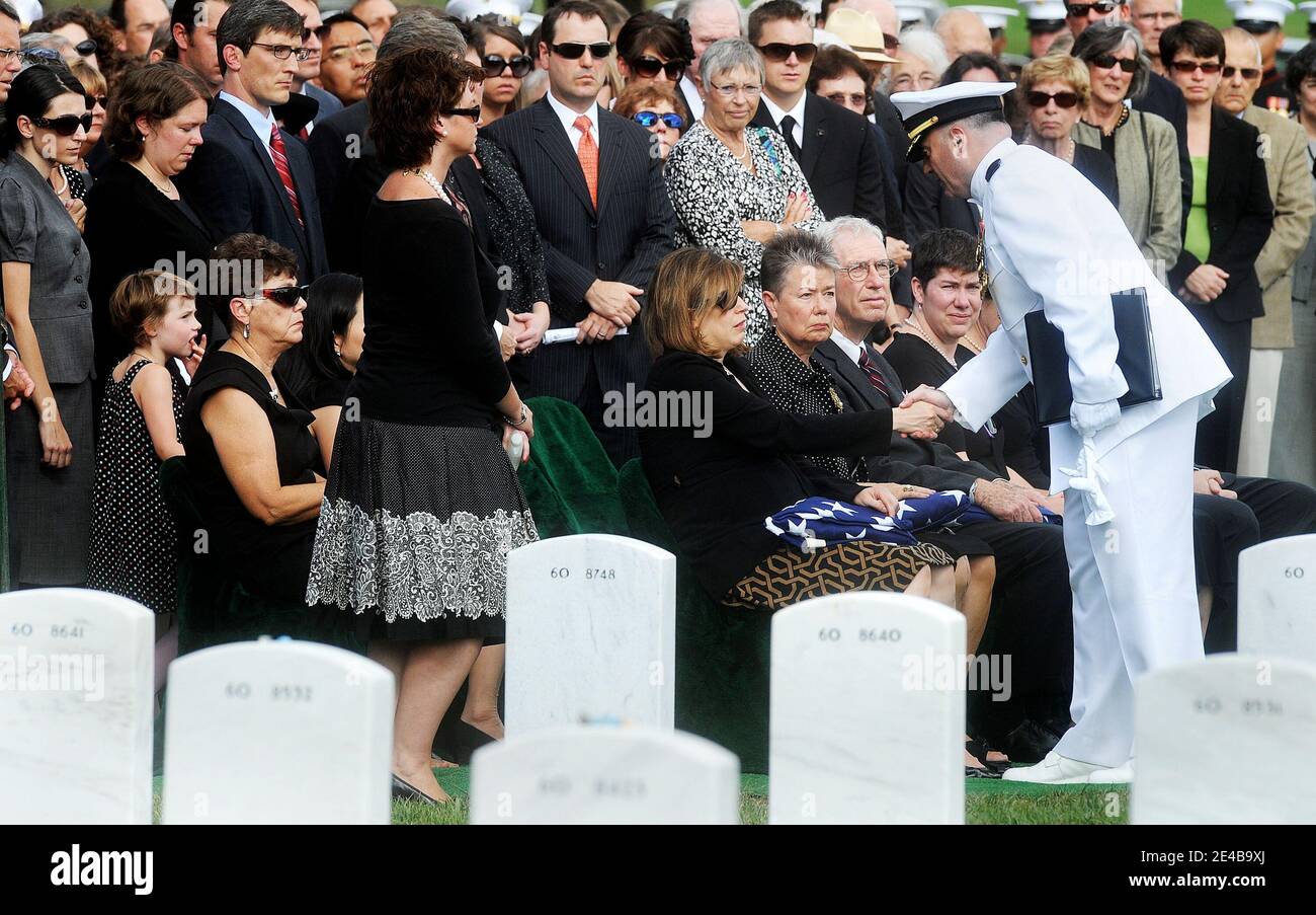 Chaplain Kieran Mandato conforts Rene Cahir wife of Marine Corps ...