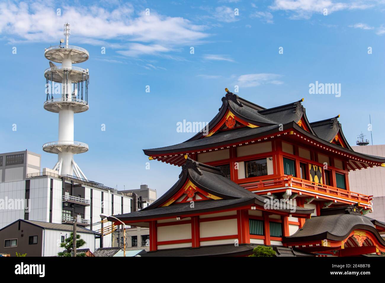 Traditional architecture with modern telecommunication tower in Kobe ...