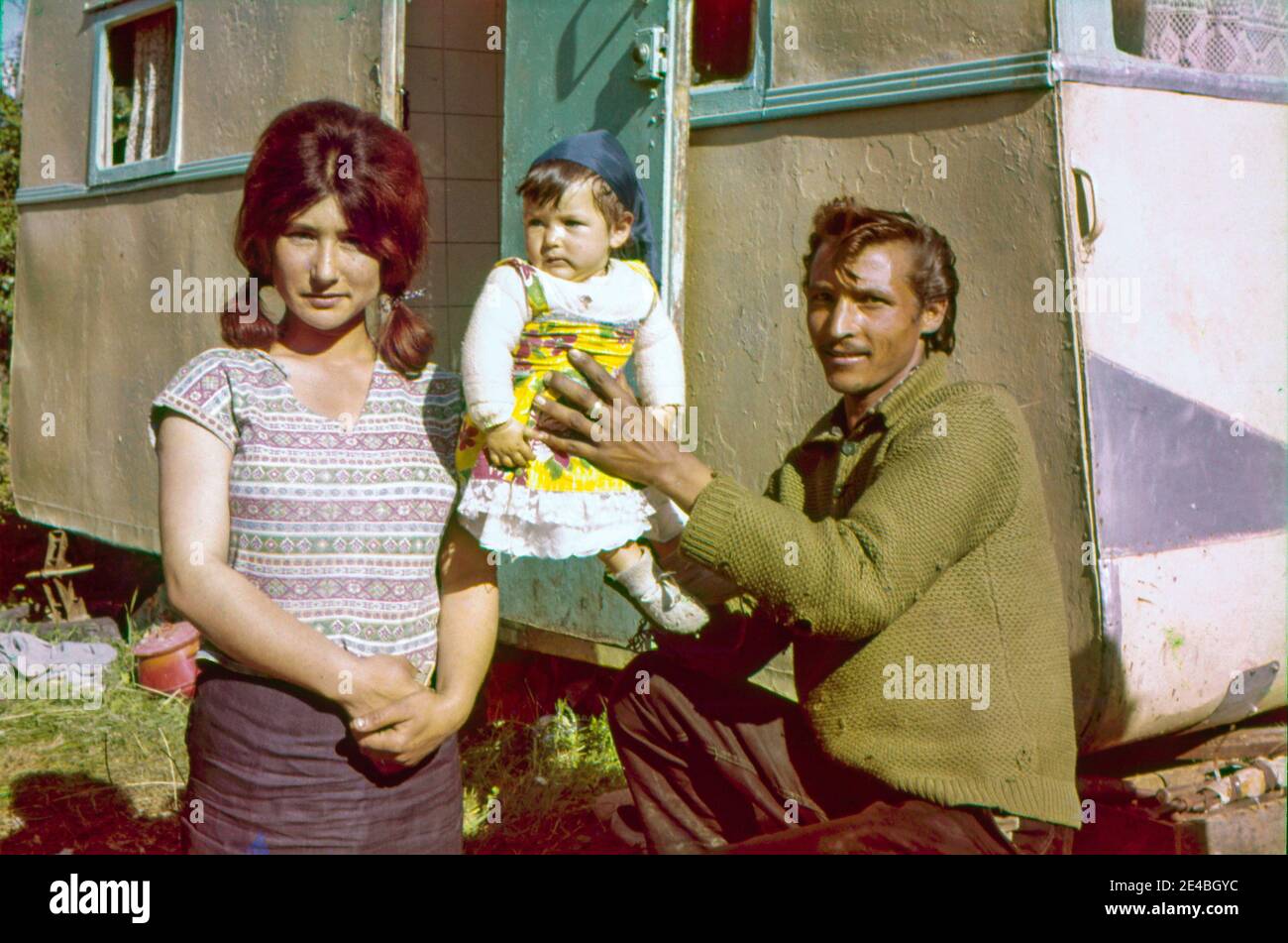 Young Gypsy couple with baby next to their caravan, La Roque-sur-Cèze ...