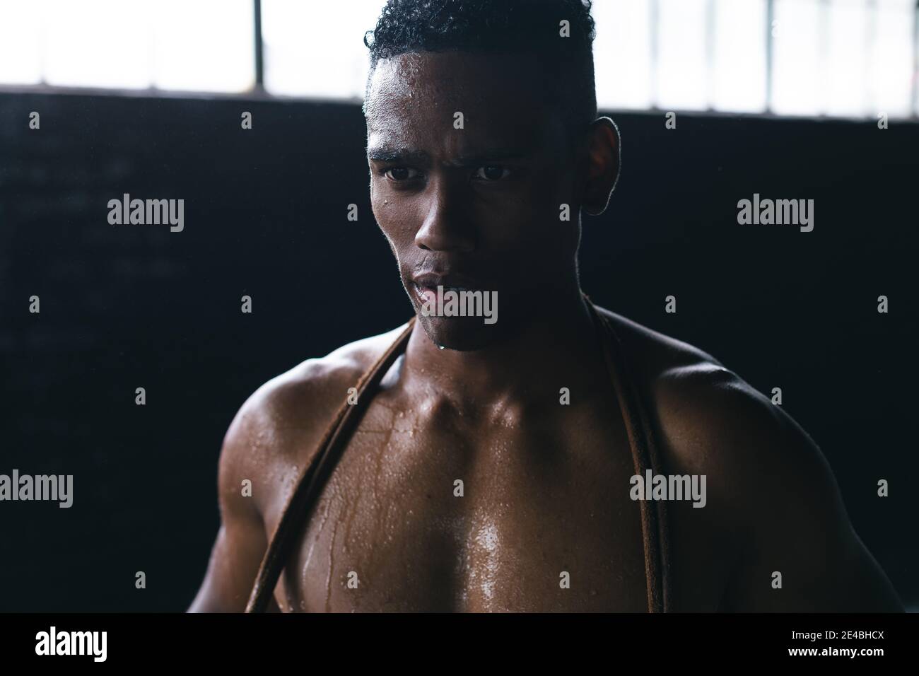 Portrait of african american man having skipping rope over his ...