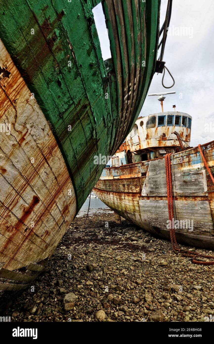 Vertical shot of two old abandoned vessels Stock Photo - Alamy