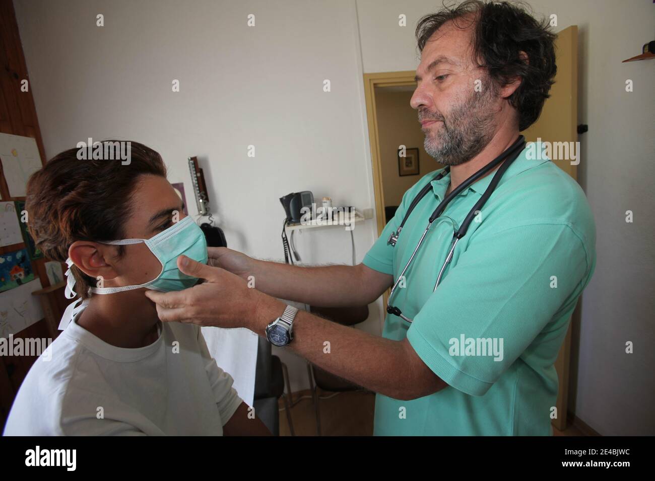 French doctor with a patient wearing a mask in Saint-Denis, on the ...