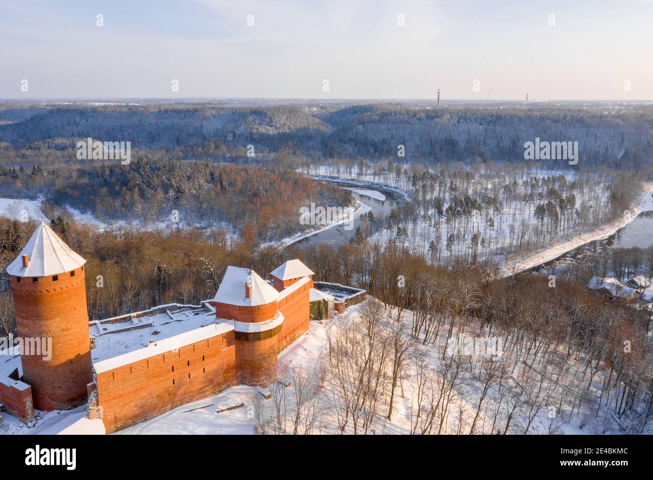 Aerial shot of snow-covered Turaida castle in Sigulda, Latvia on a ...