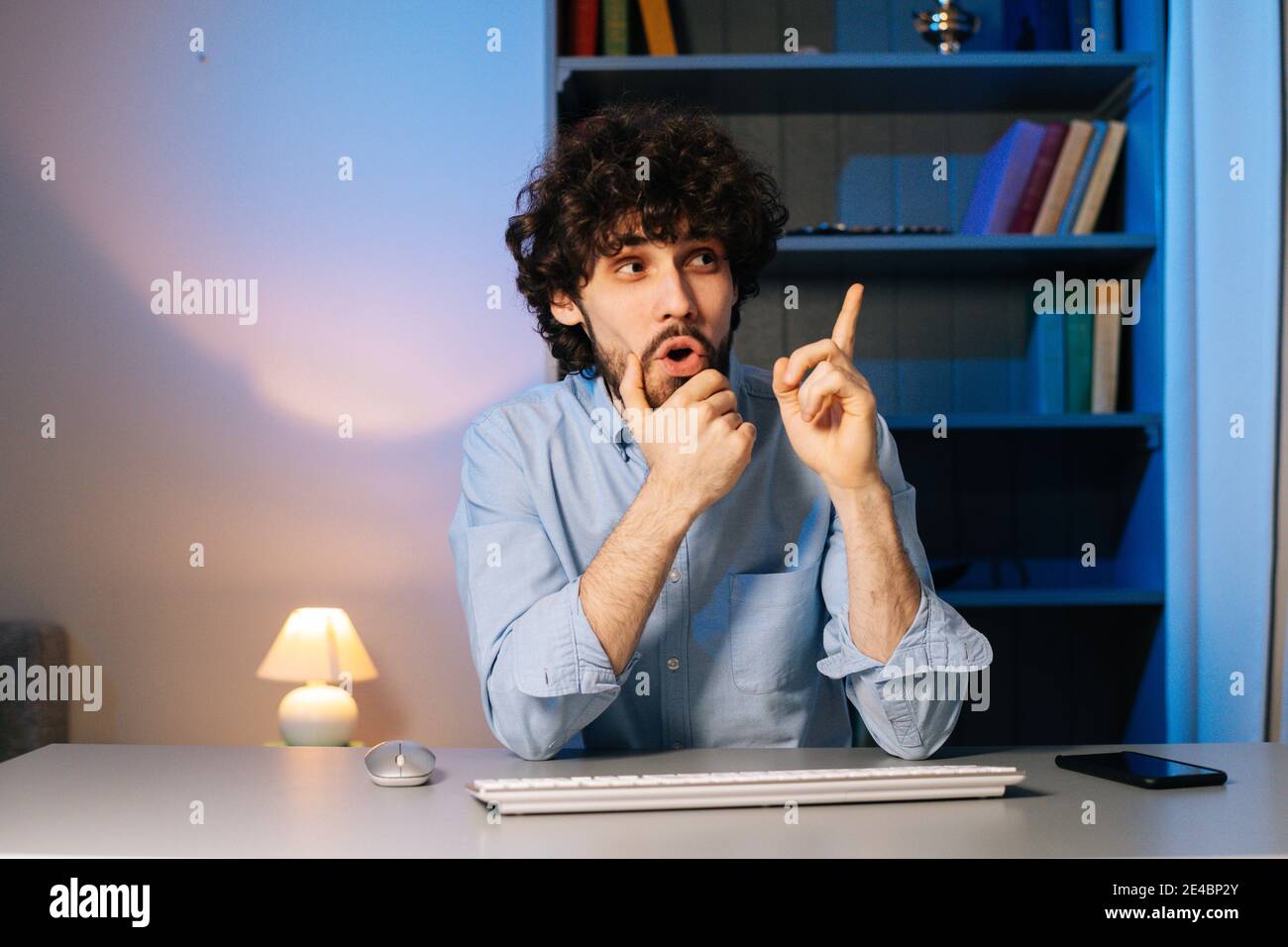 Front view of happy man looking away and starts typing on wireless ...