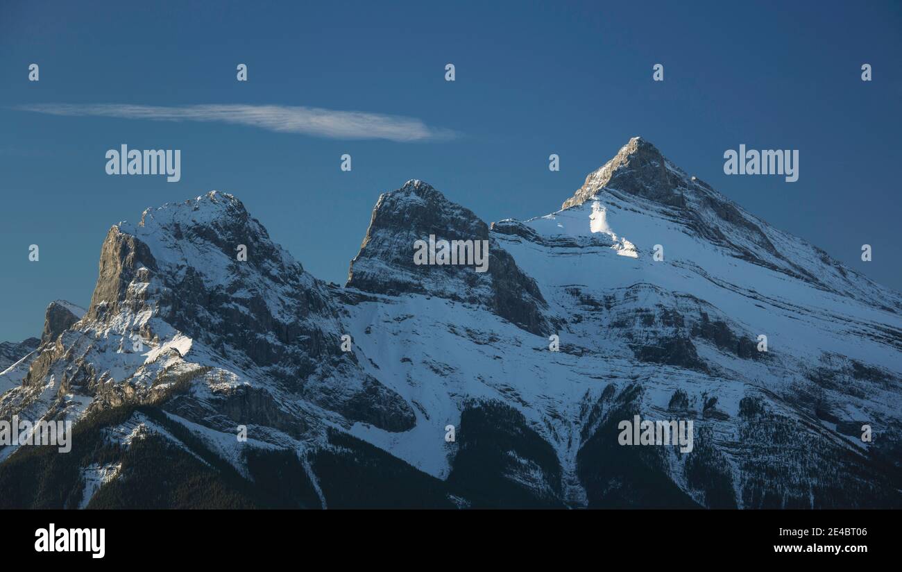 Snow covered mountains, Three Sisters, Canmore, Alberta, Canada Stock ...