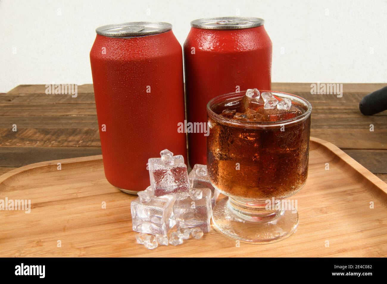 Soda can with a glass full of ice and drink on bamboo tray Stock Photo ...