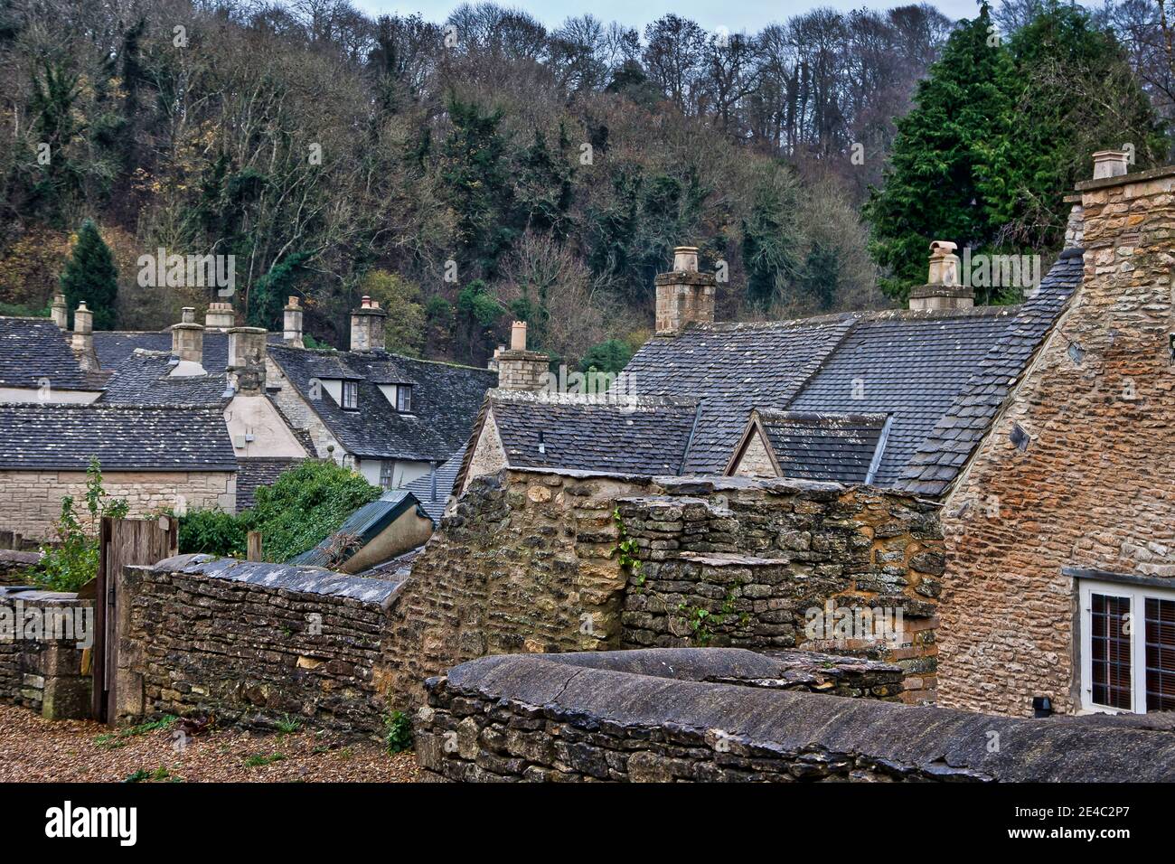 Rooftops and walls of the "historic" village of Castle Coombe ...