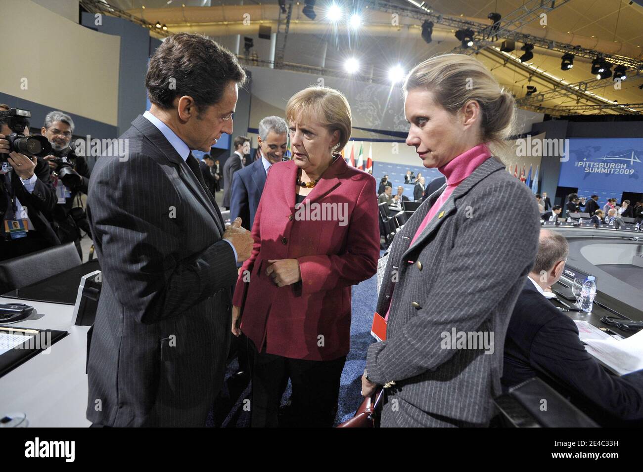 French President Nicolas Sarkozy speaks with German Chancellor Angela ...