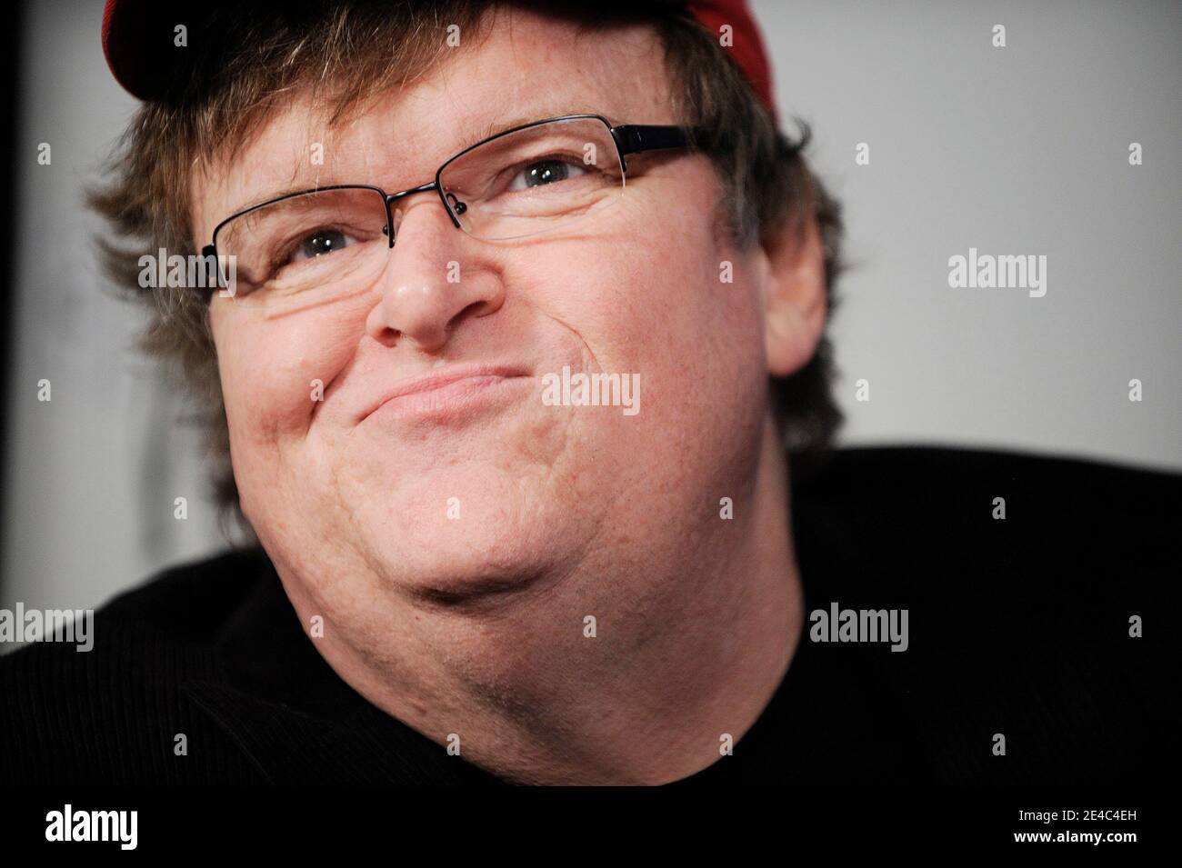 Filmmaker Michael Moore attends at a news conference after challenging ...