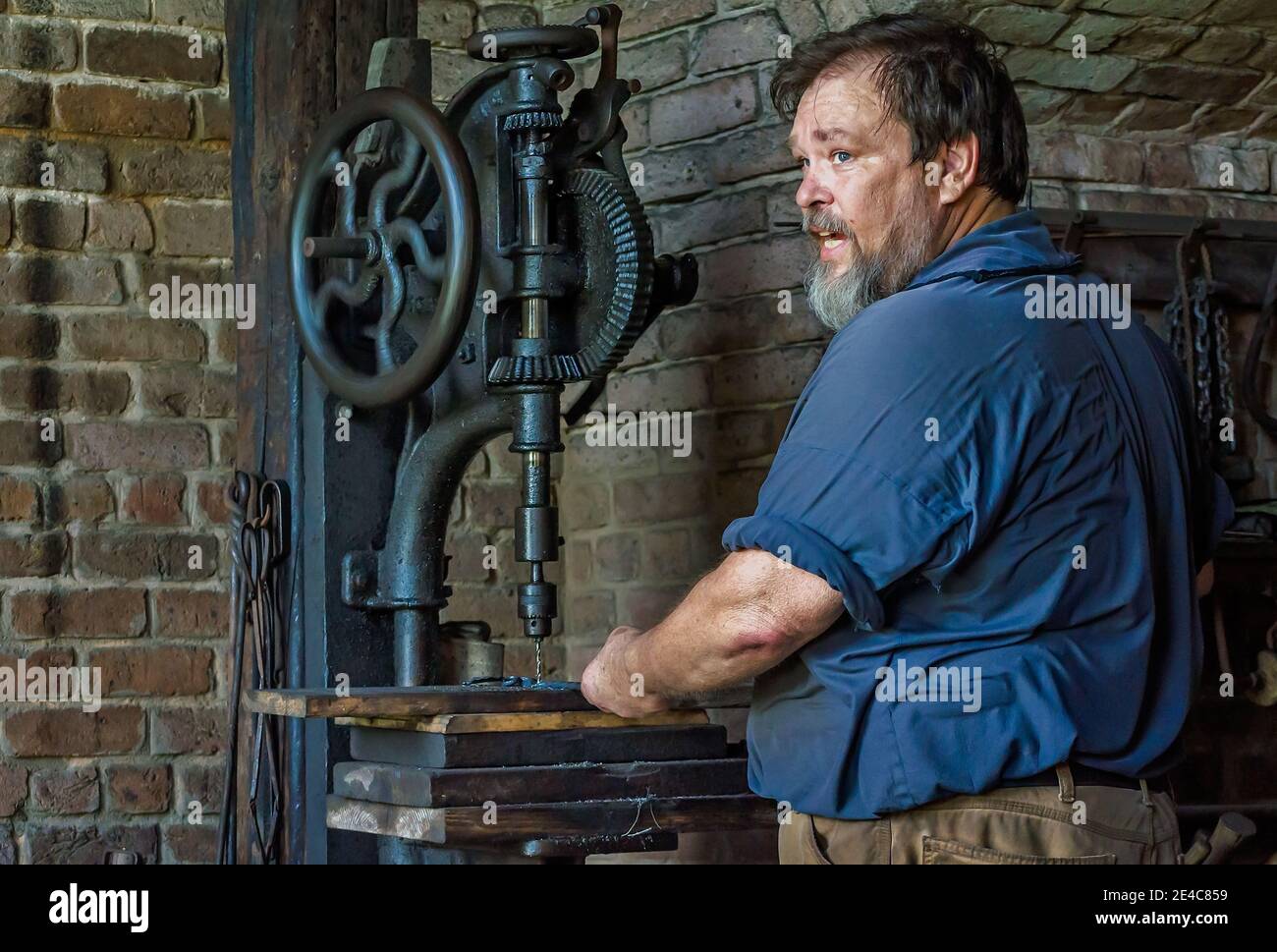 Blacksmith Ralph Oalmann explains how he uses an antique drill press in ...