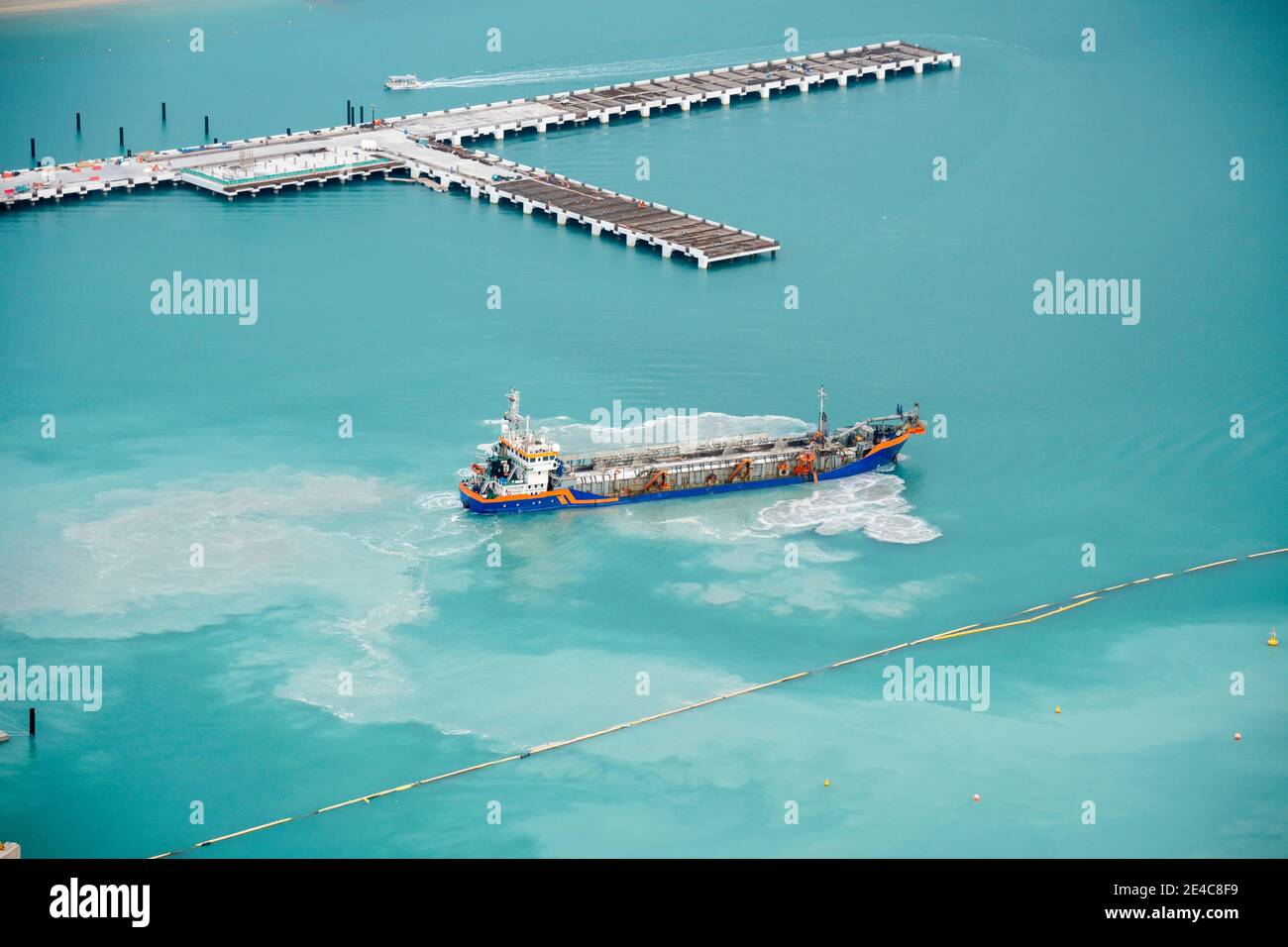 Suction Dredger ship working near the port - with mud, Pollution, brown ...