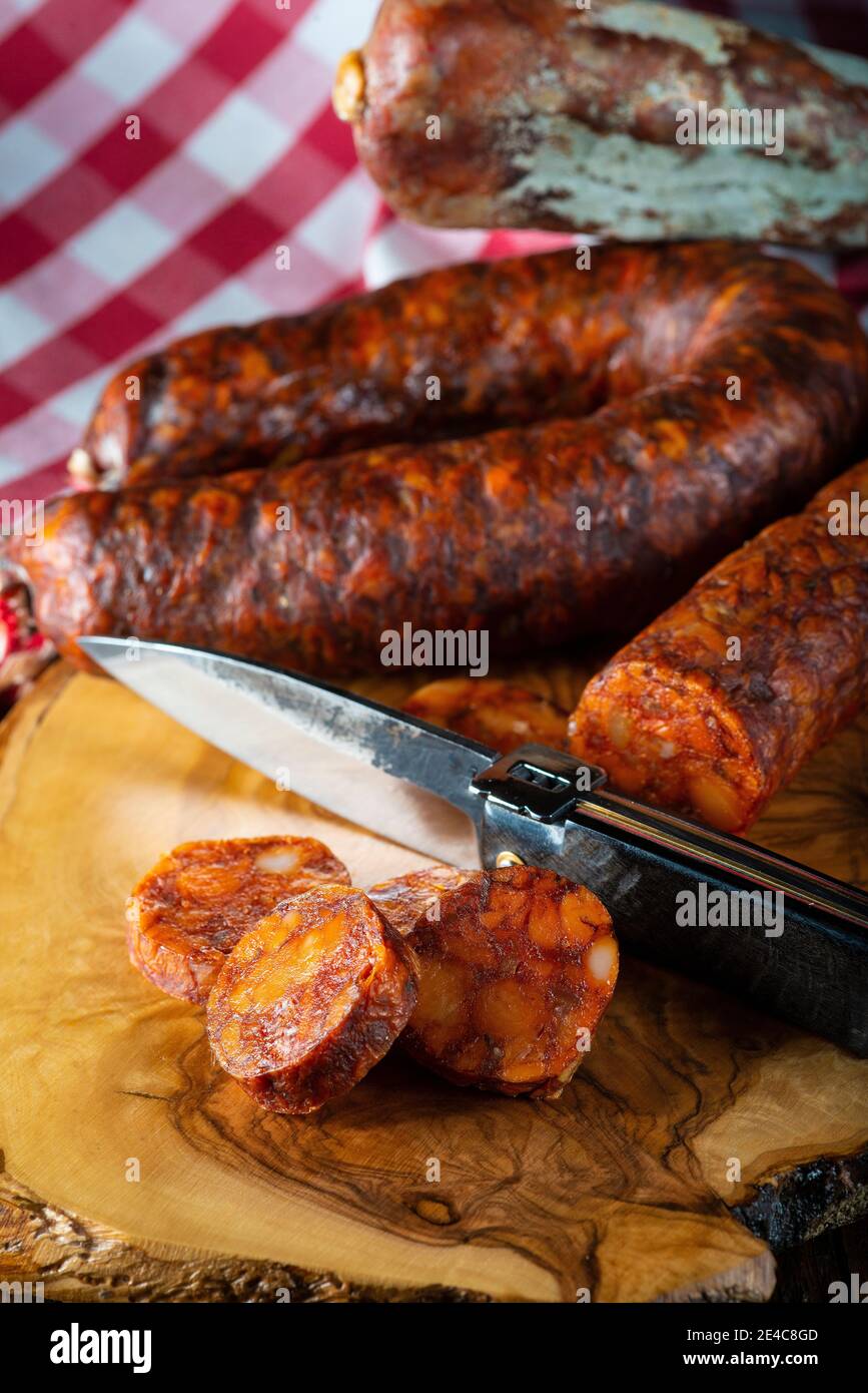 Variety of Spanish chorizo and sausages wit a knife to slice them Stock ...