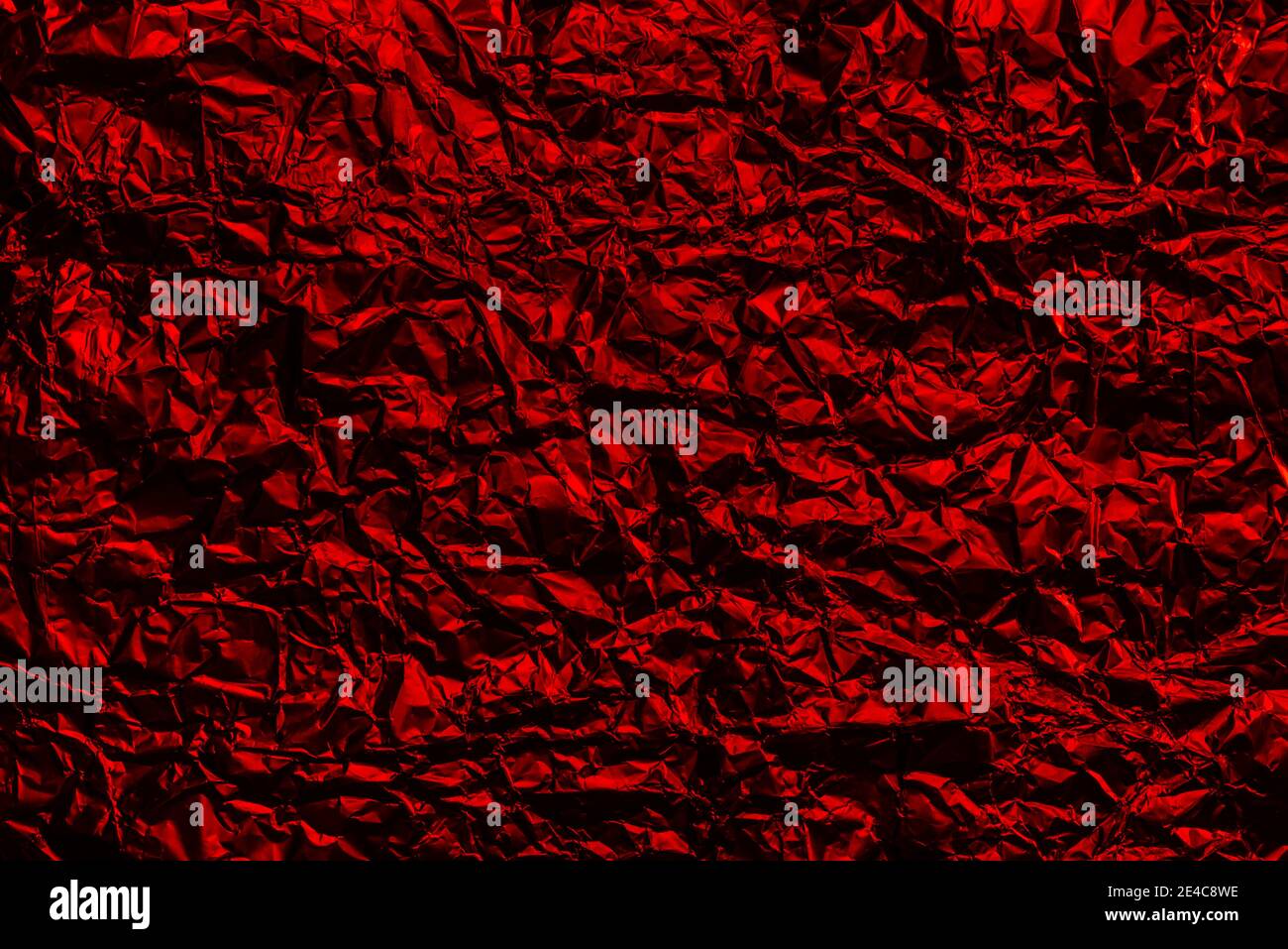Red foil background with shiny crumpled surface for texture background ...