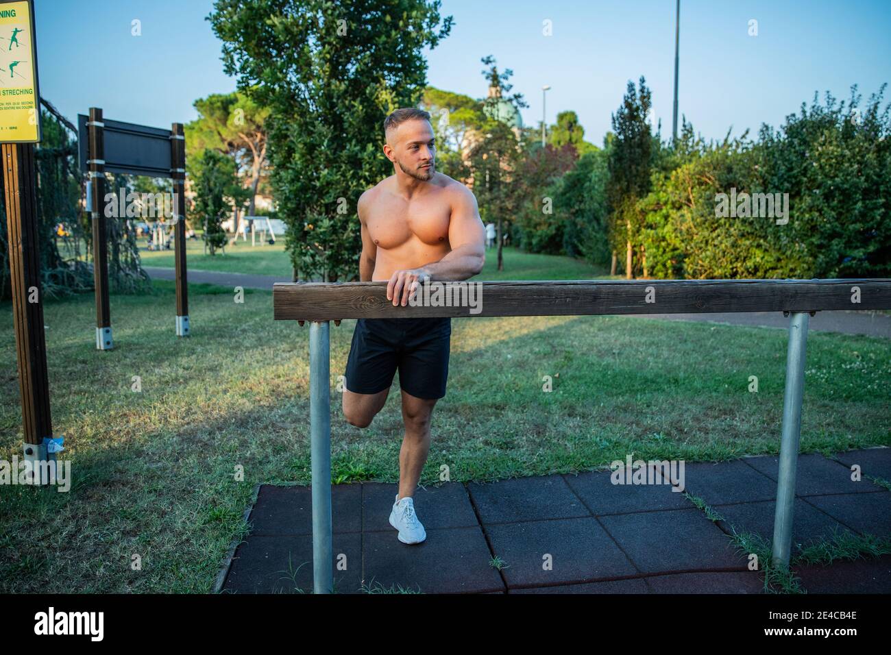 Stretching exercises done by a young white male, conceptual pose Stock ...