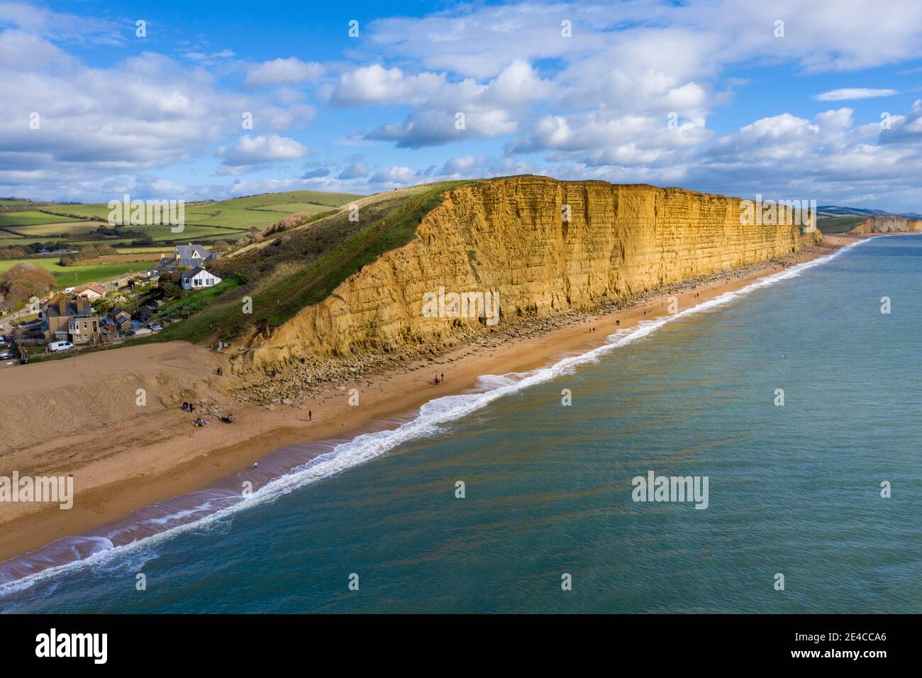 Drone aerial views of the beach and cliffs in West Bay in Dorset Stock ...