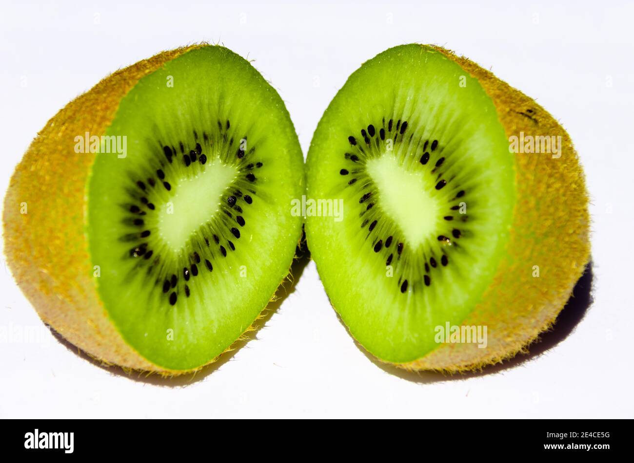 Parts of a kiwi on a white background Stock Photo - Alamy