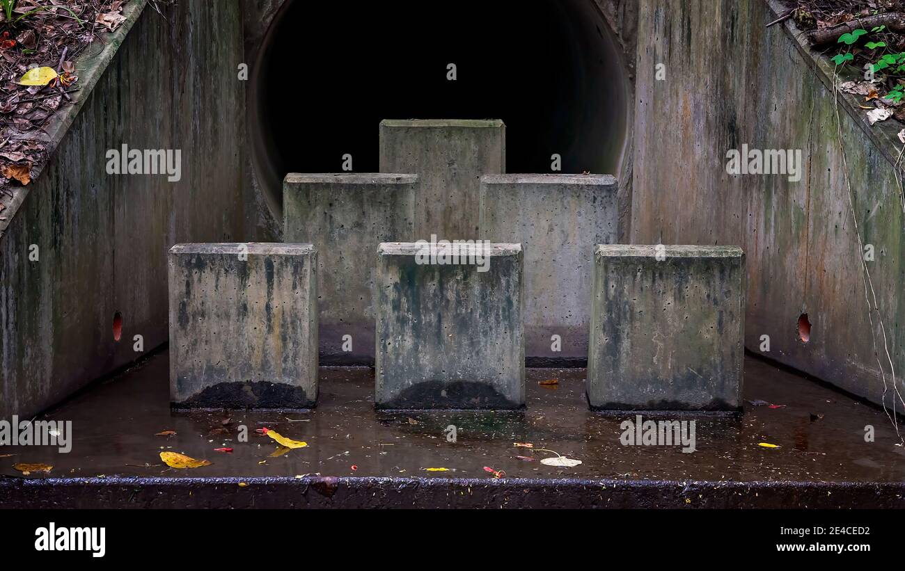 Storm water drain with six square and rectangle shaped concrete ...