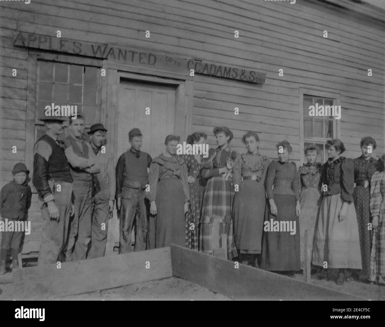 American archive monochrome photo of a group of male and female workers ...