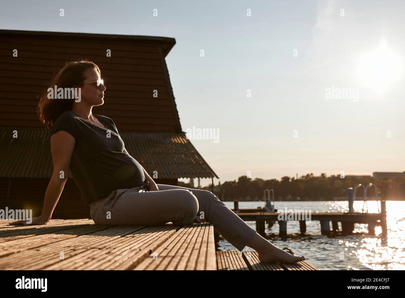 pregnant woman, landing stage, relax Stock Photo - Alamy