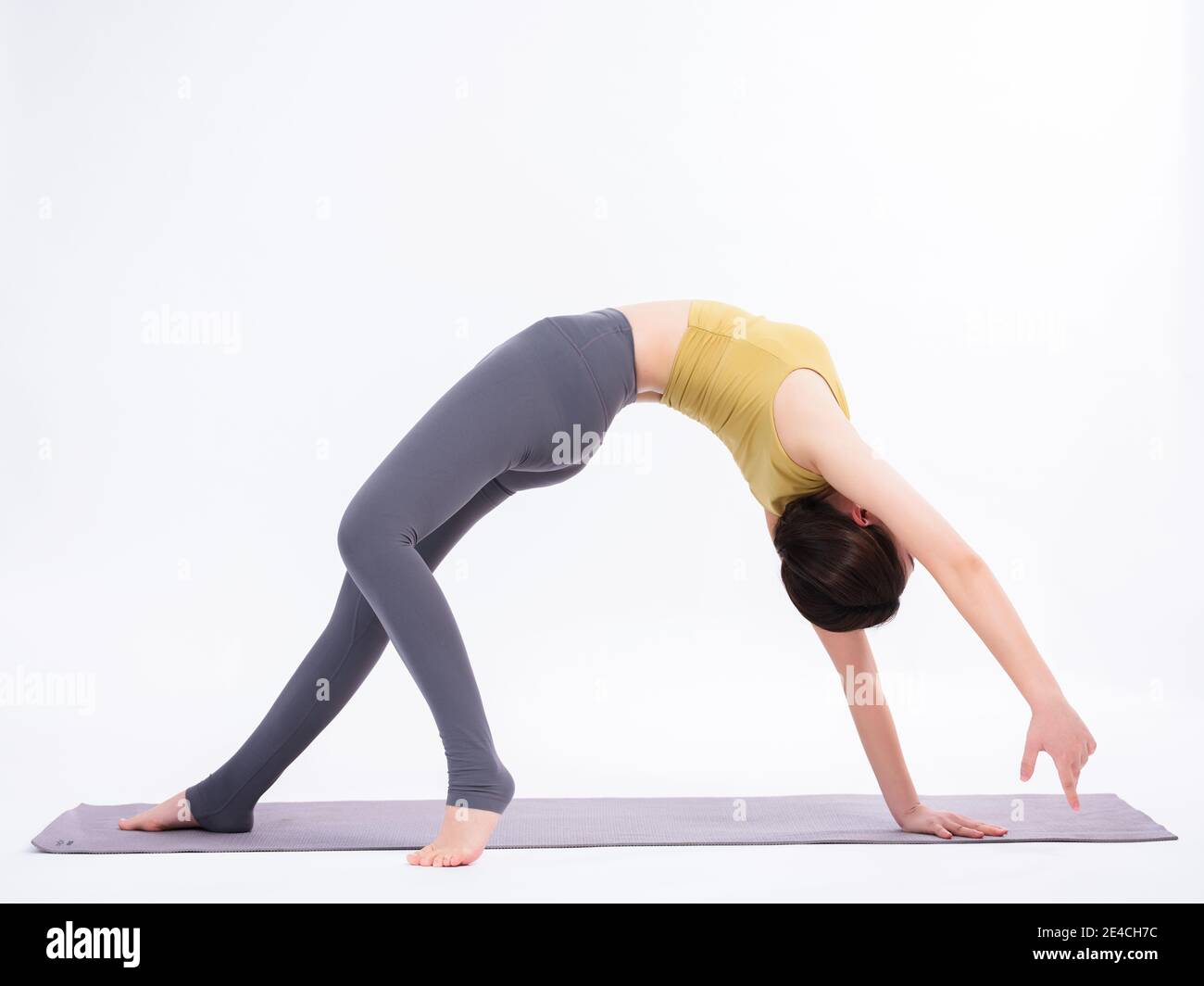 Young women practice yoga with back bending Stock Photo - Alamy