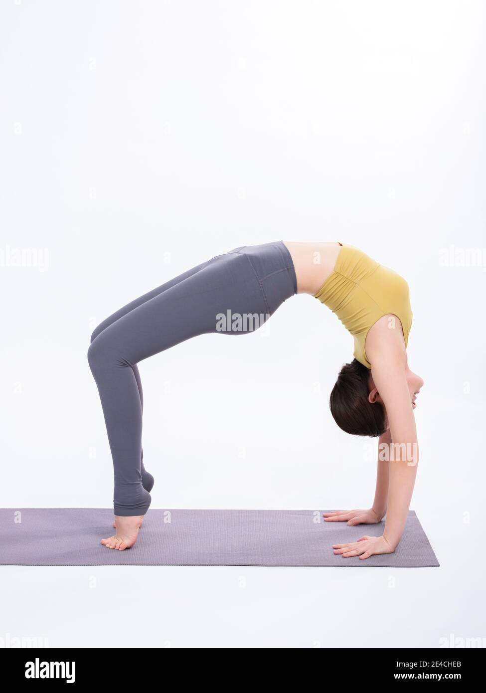 Young women practice yoga with back bending Stock Photo - Alamy