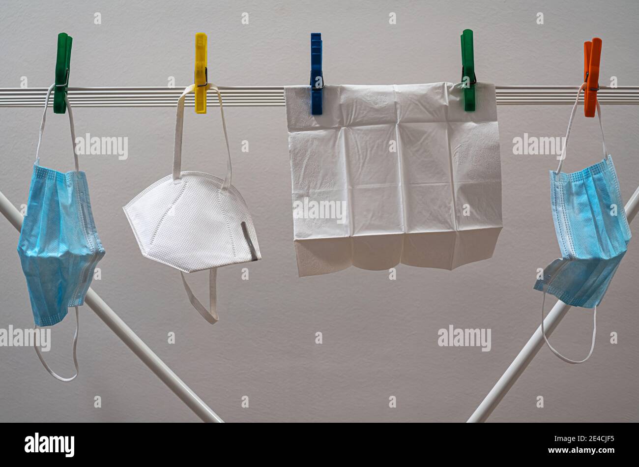 Mouth nose masks and handkerchiefs hang on a clothesline hi-res stock ...