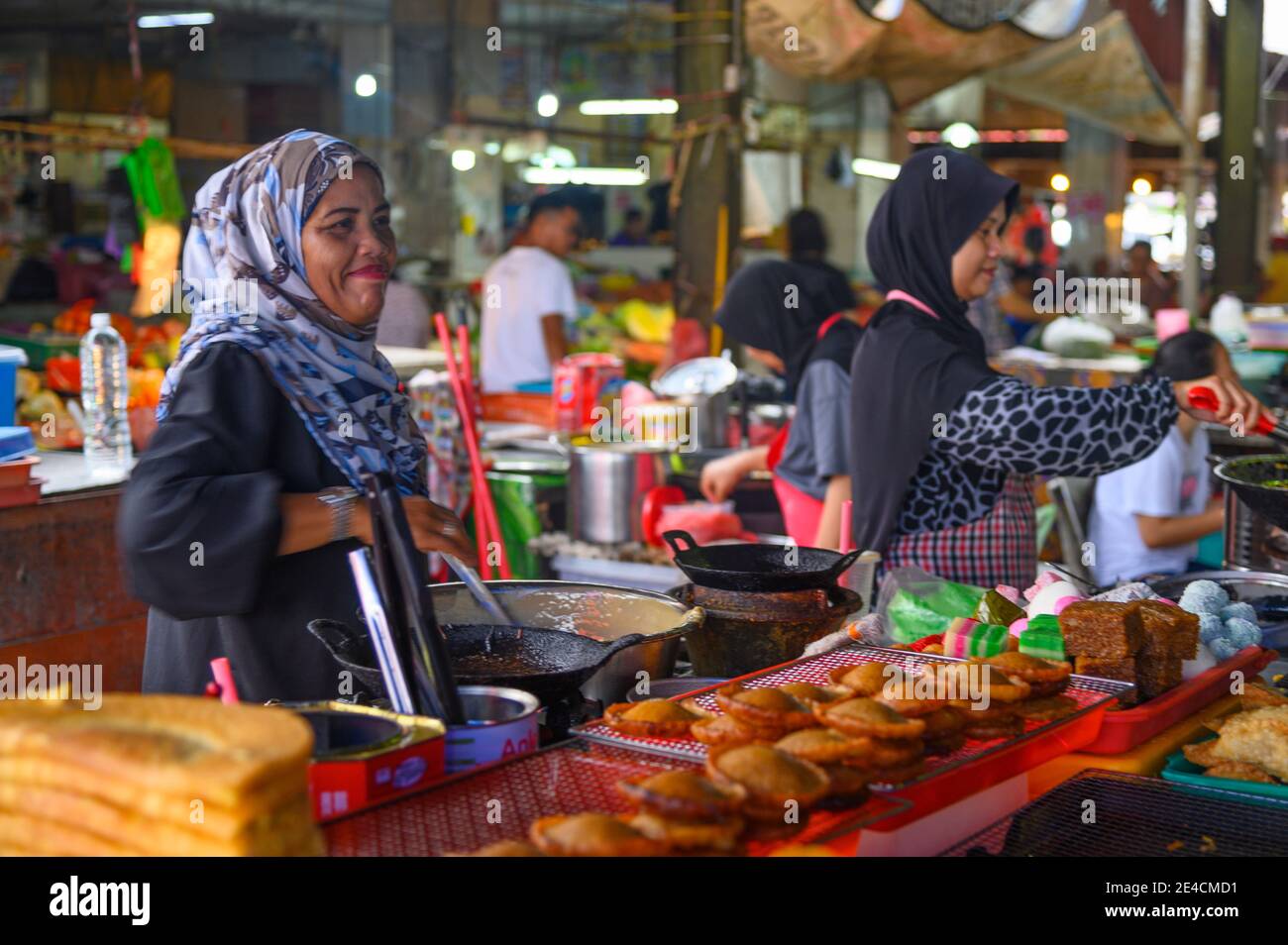 women at food stall inside the Lachau Bazaar in Malaysia Stock Photo ...