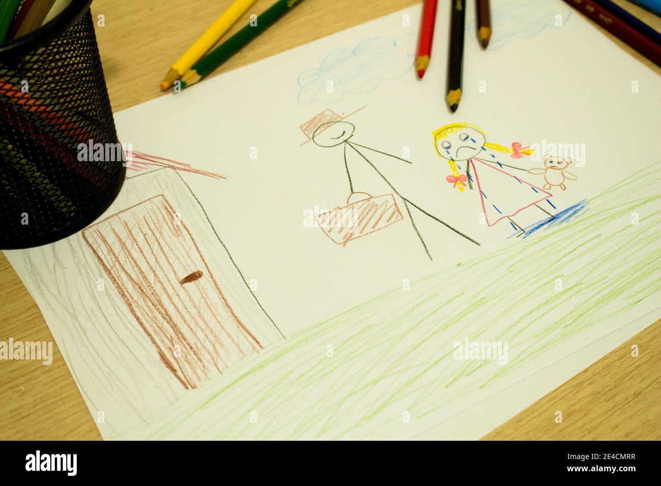 Childlike drawing of a blonde girl crying next a male. There are ...