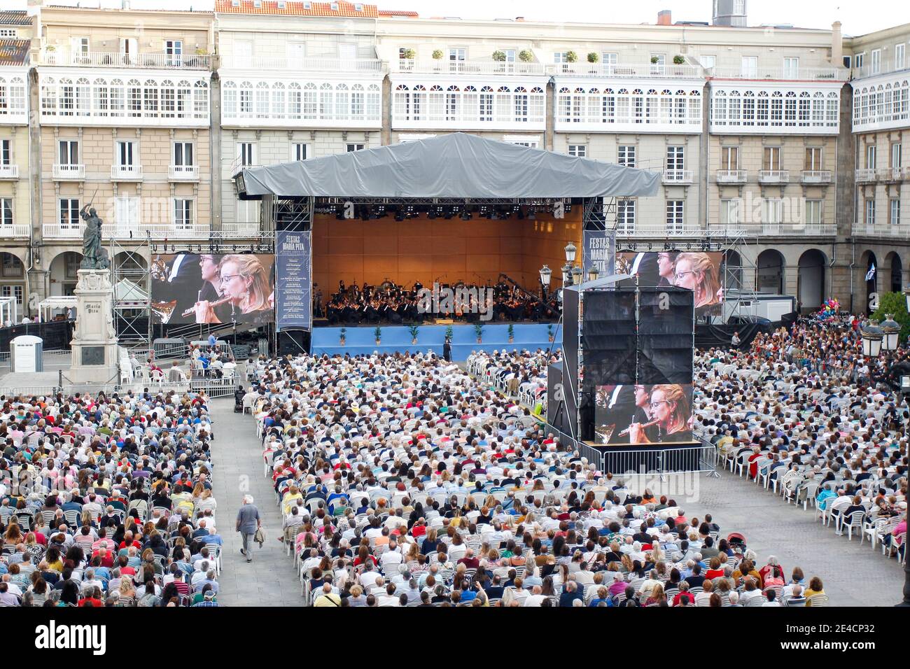 Coruna, Spain. Audience watching, seated and standing, the concert of ...