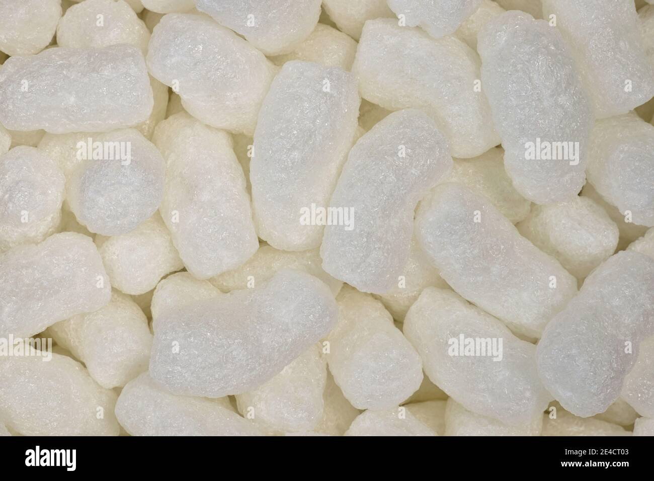 White packing peanuts styrofoam popcorn packaging material closeup flat ...