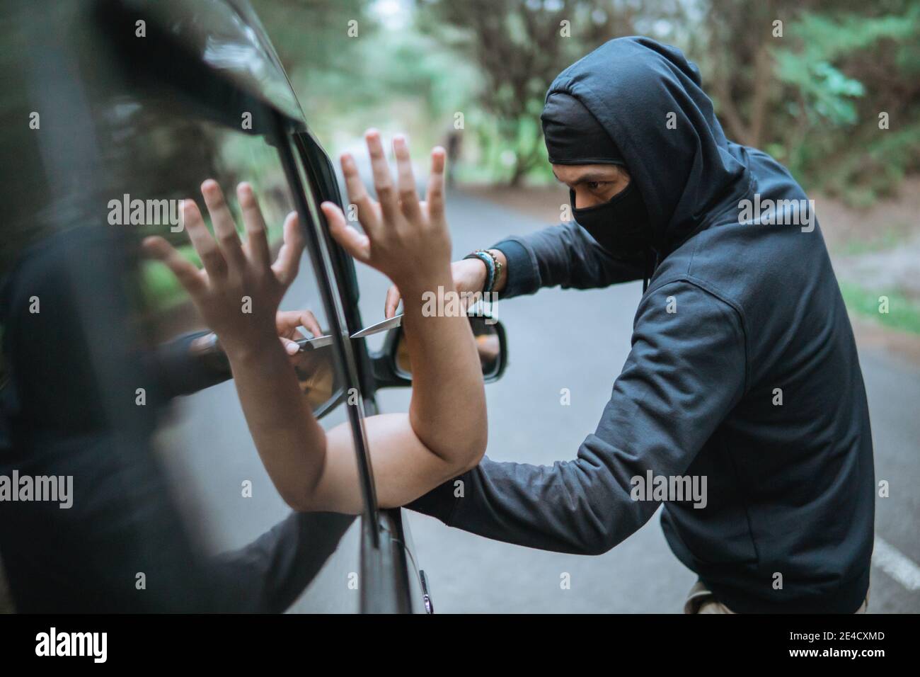 Violent robber hi-res stock photography and images - Alamy