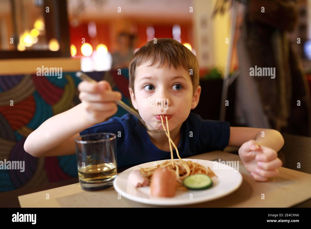 Child eating pasta lunch dinner hi-res stock photography and images - Alamy