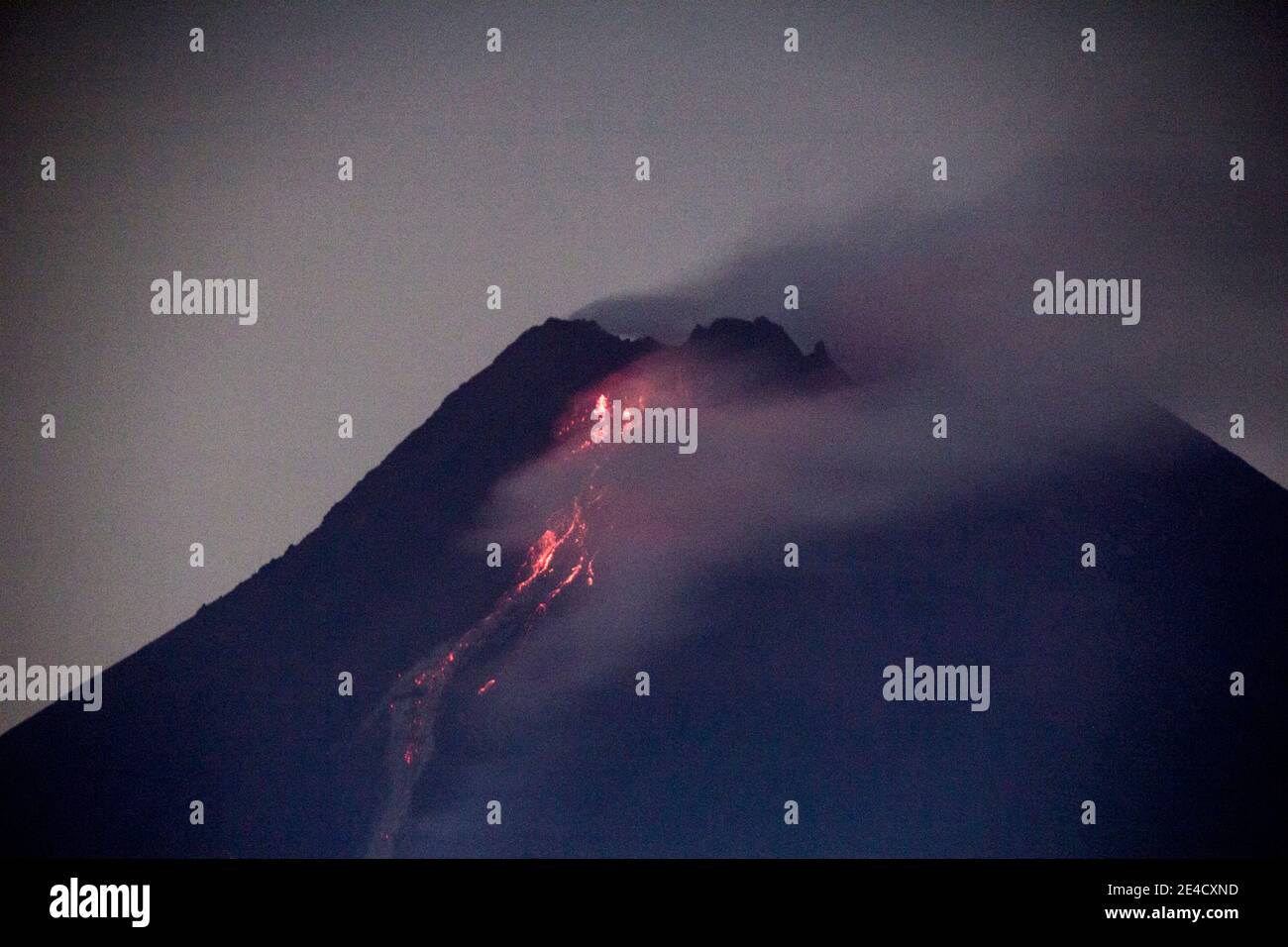 Sleman, YOGYAKARTA, INDONESIA. 21st Jan, 2021. Lava and hot clouds flow ...