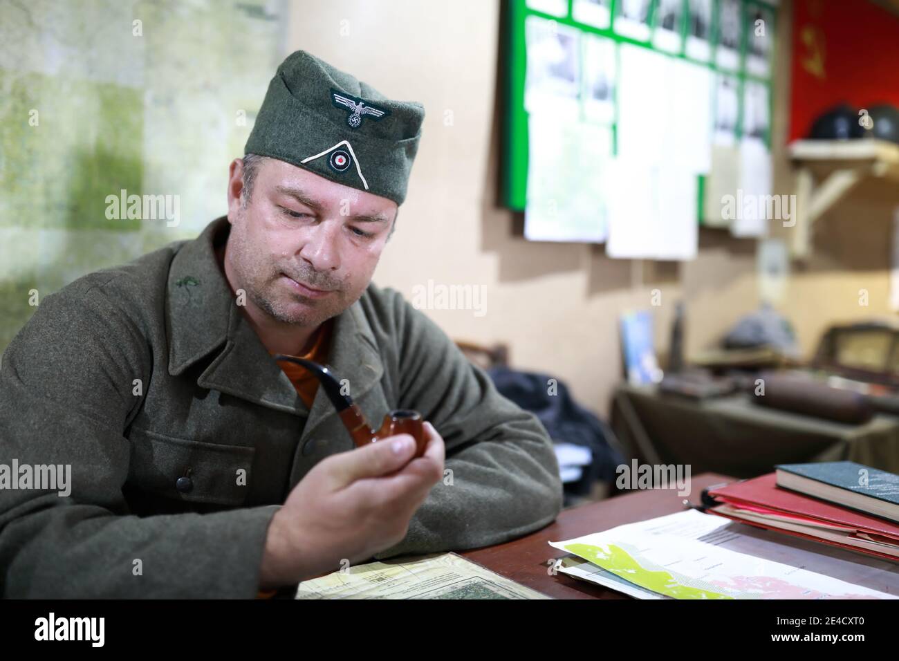 Portrait of man in uniform of Wehrmacht soldier with smoking pipe Stock ...