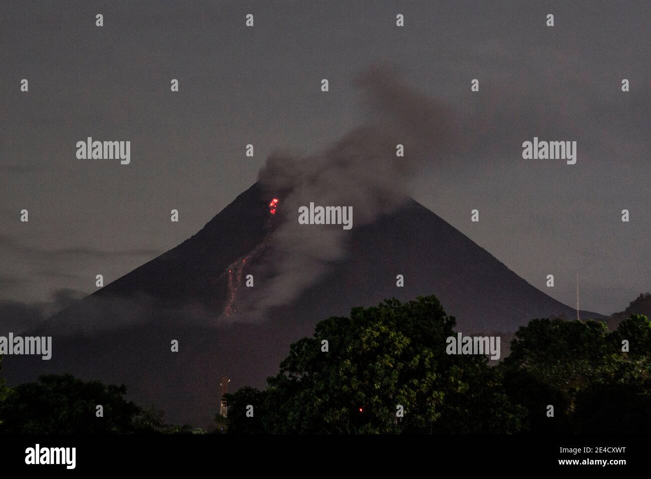 Sleman, YOGYAKARTA, INDONESIA. 21st Jan, 2021. Lava and hot clouds flow ...