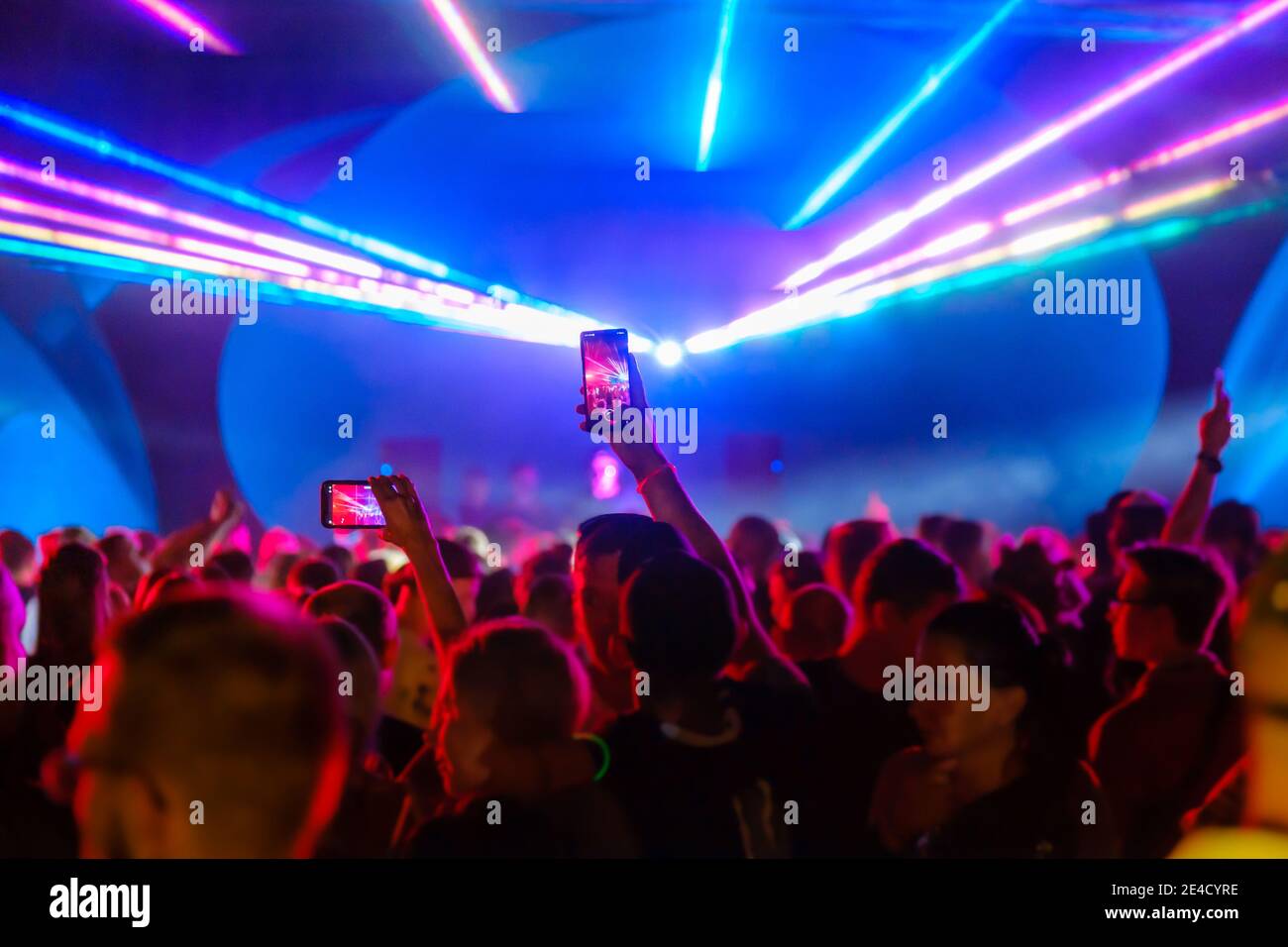 Crowd and DJs dancing during party Stock Photo - Alamy
