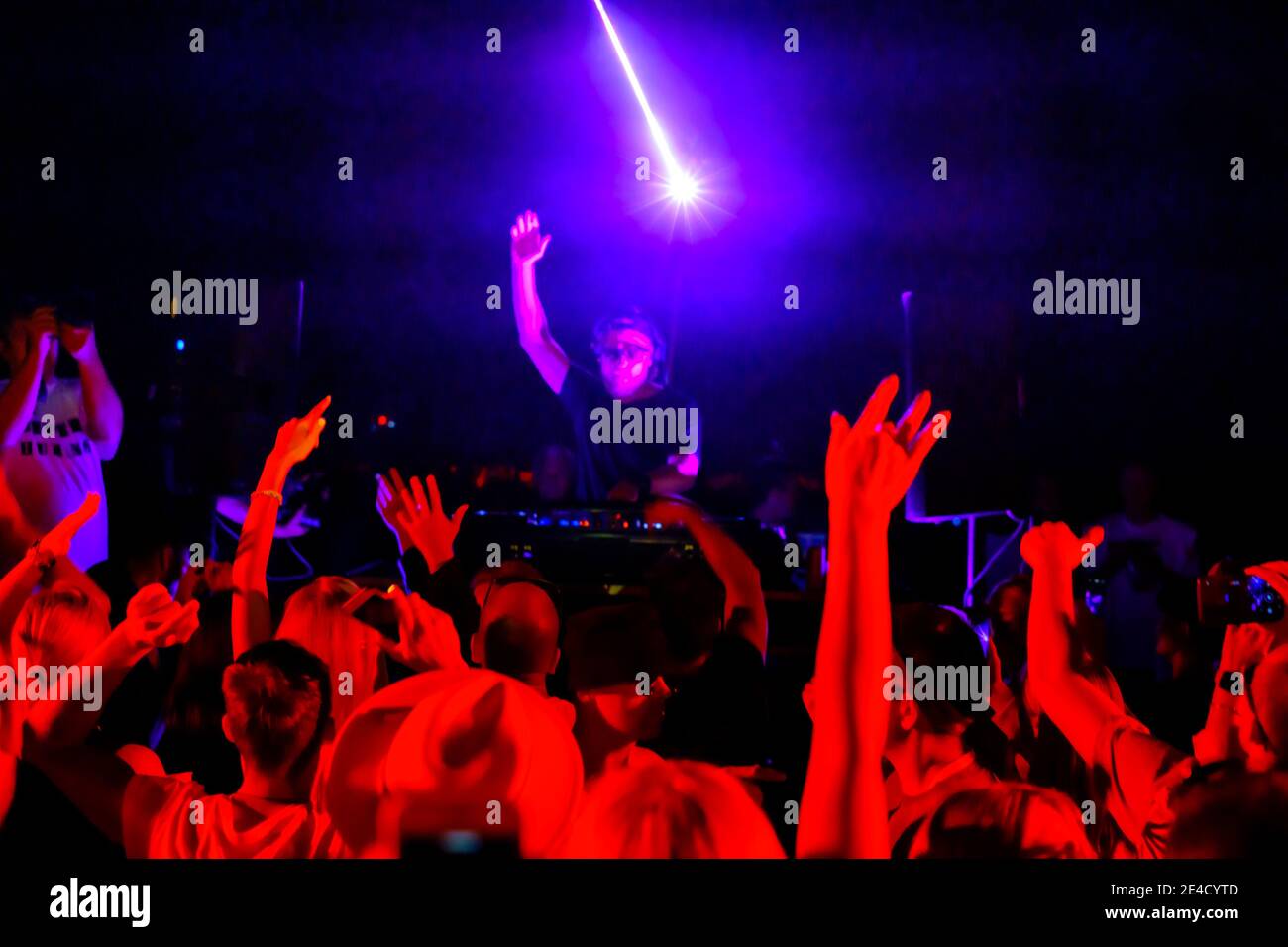 Crowd and DJs dancing during party Stock Photo - Alamy