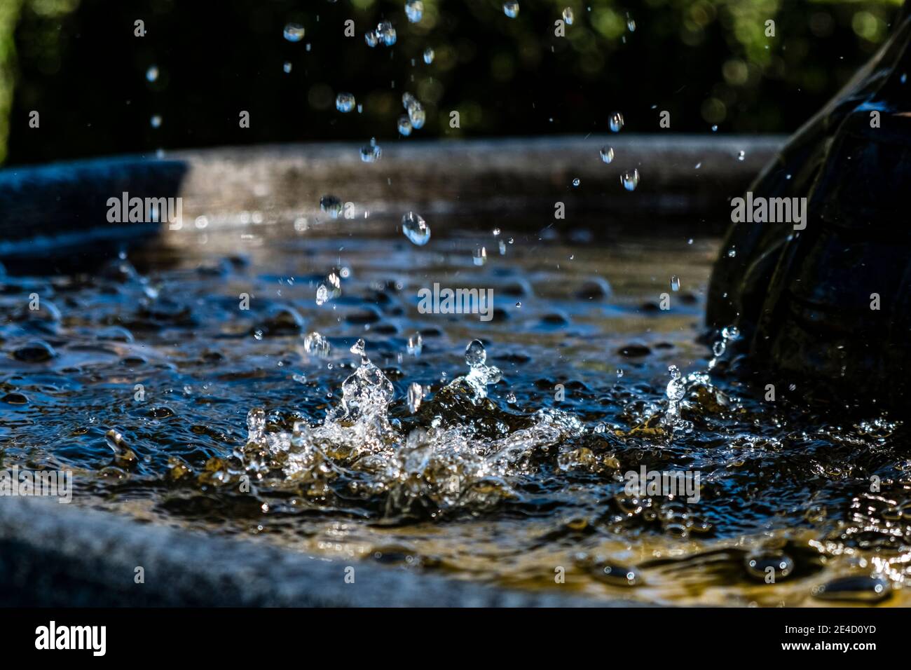 Droplets hitting water surface in a fountain Stock Photo - Alamy