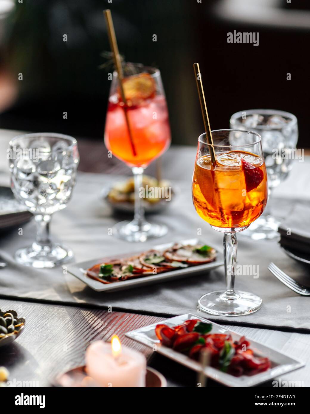 Aperol spritz cocktails on the served table Stock Photo - Alamy