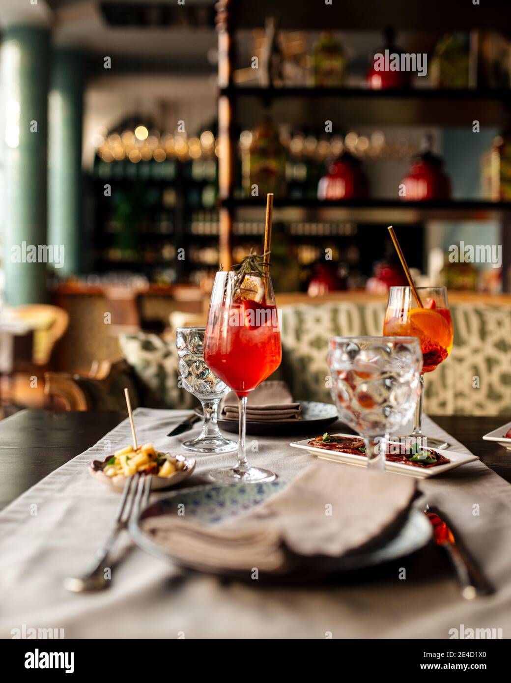 Served table with aperitif cocktails and appetizer Stock Photo - Alamy