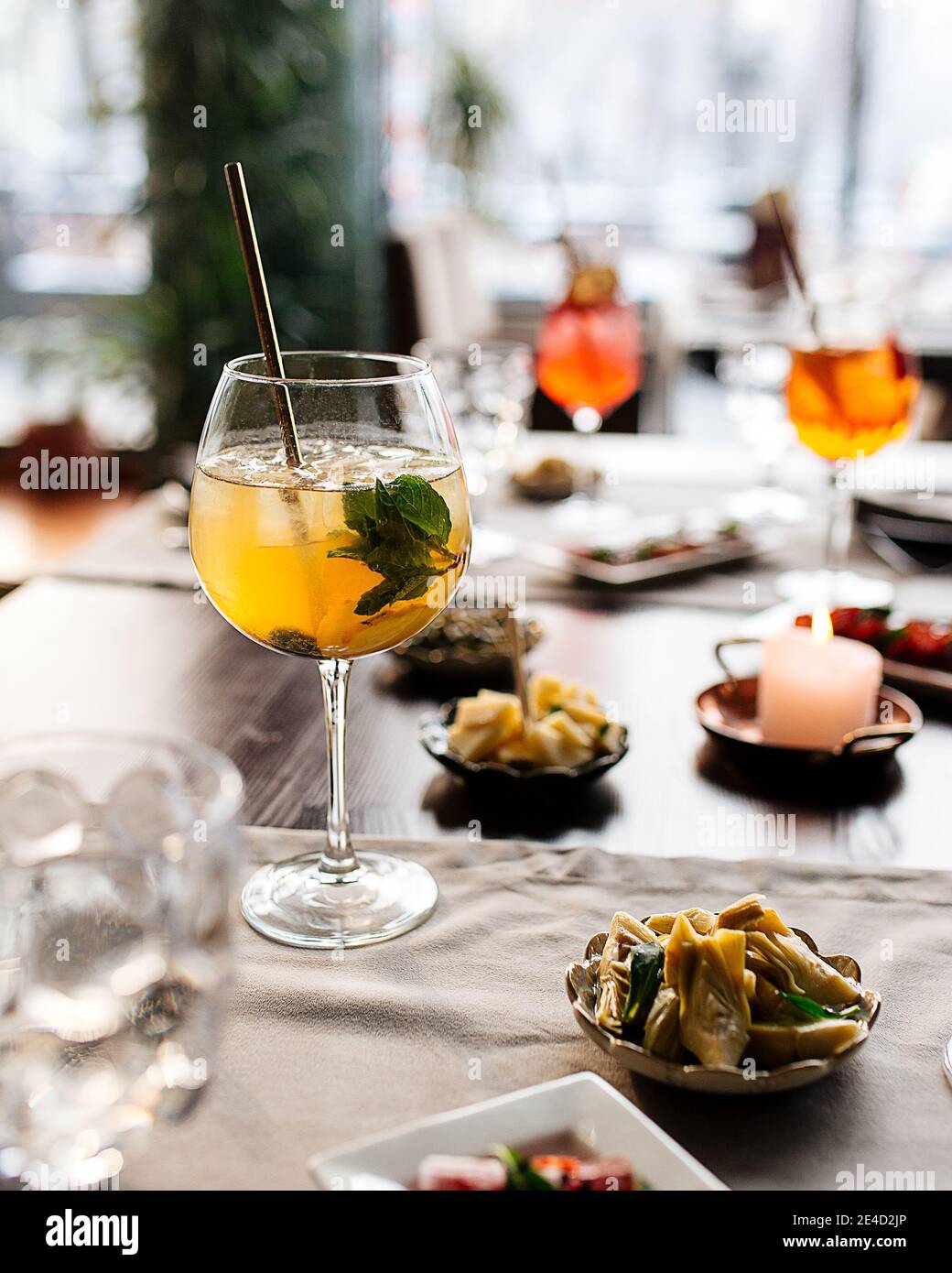 Served table with aperitif cocktails and appetizer Stock Photo - Alamy