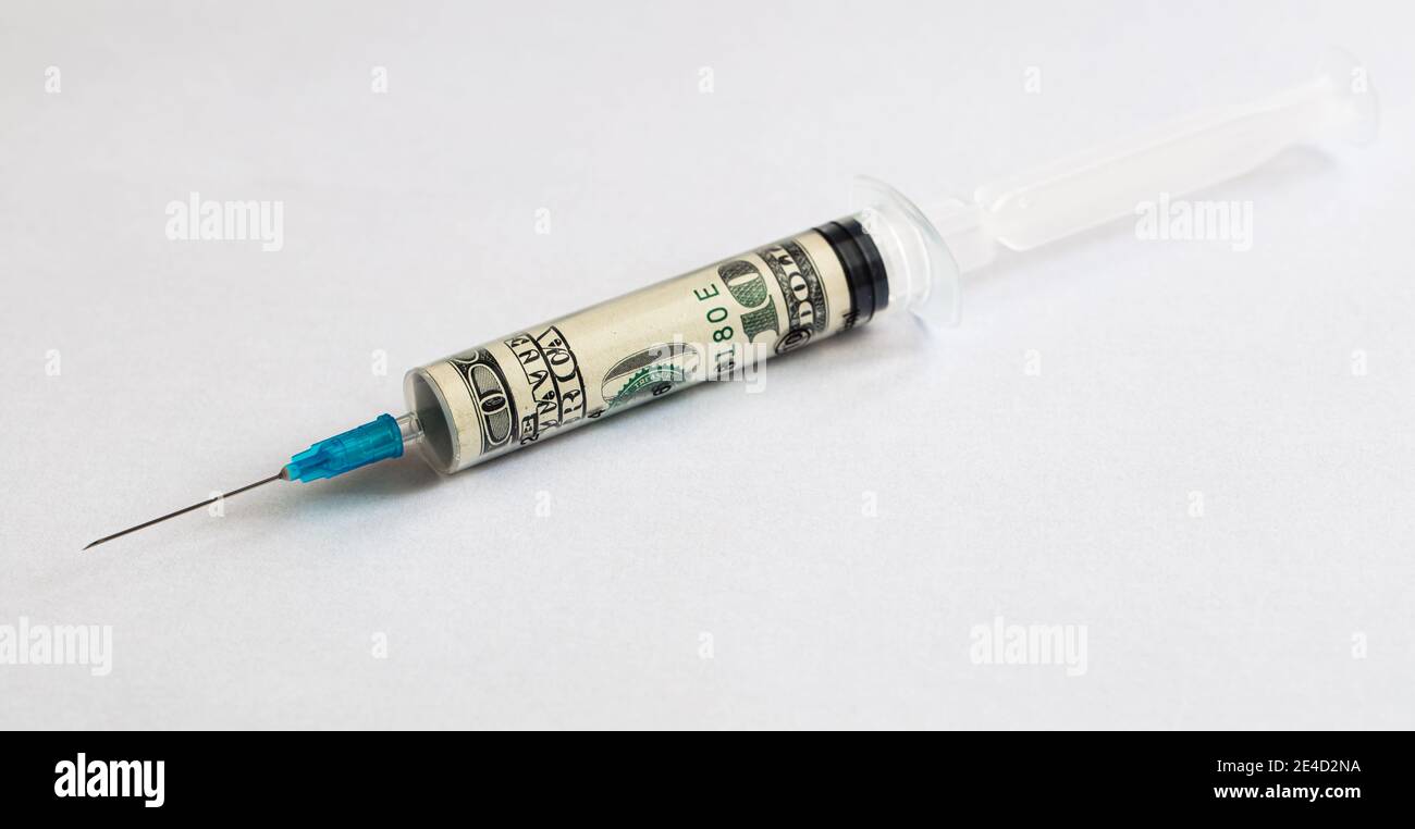 Syringe with 100 dollar banknote inside on white background Stock Photo ...