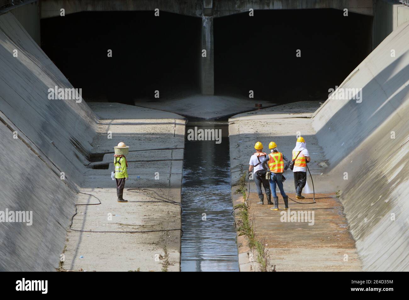 Maintenance workers in a nullah in Yuen Long Stock Photo - Alamy