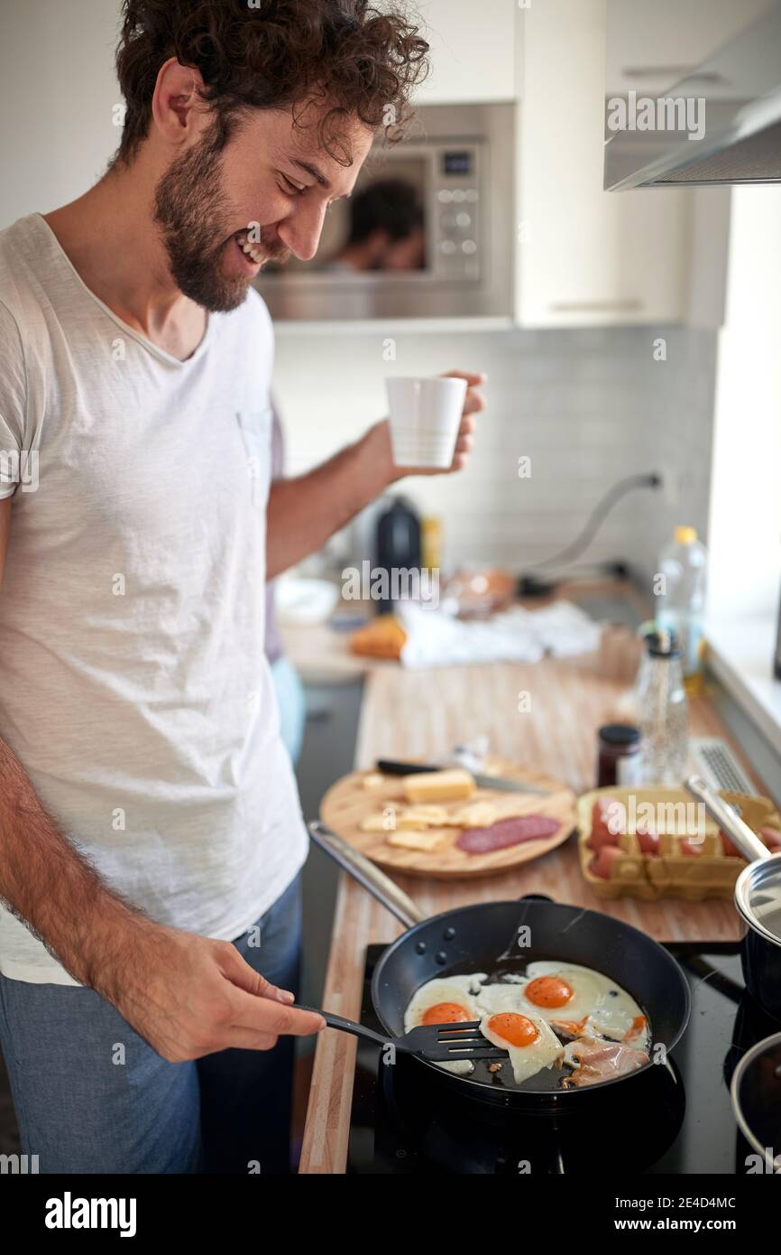 Boyfriend making breakfast for his girlfriend in the morning Stock ...
