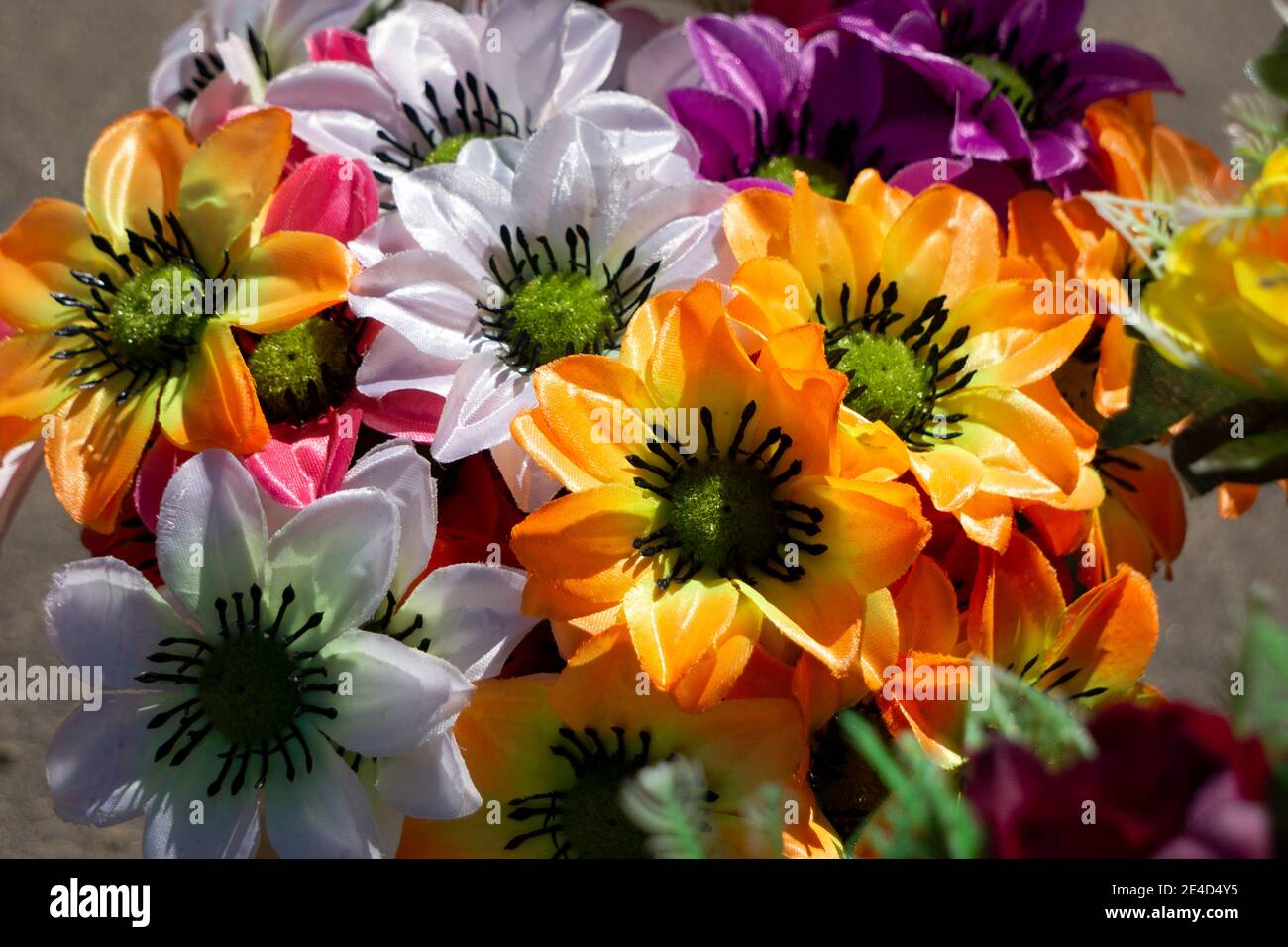 beautiful colors of plastic flowers background colorful Stock Photo - Alamy