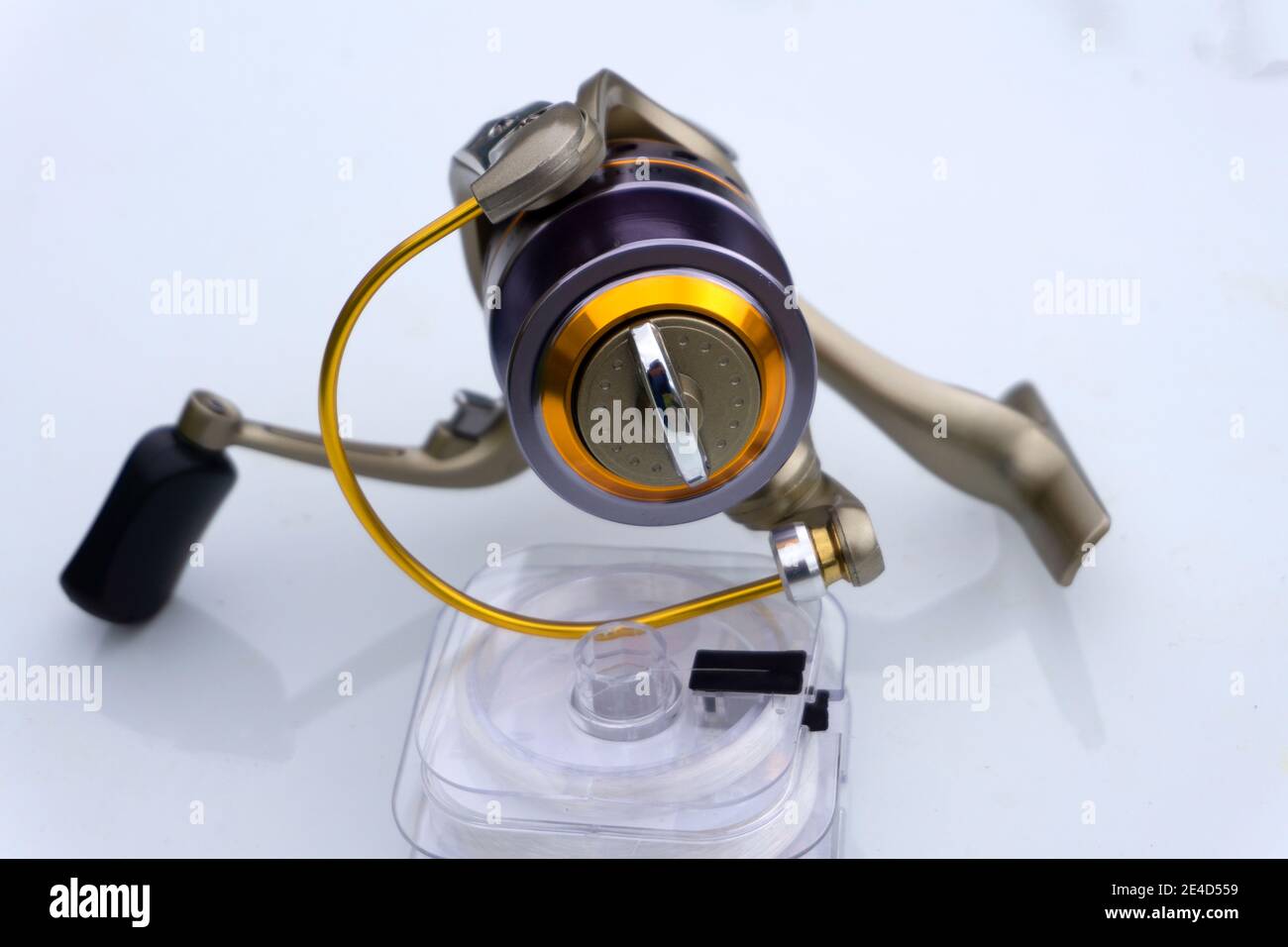 New modern reel for fishing in water. Studio shot, isolated on white ...