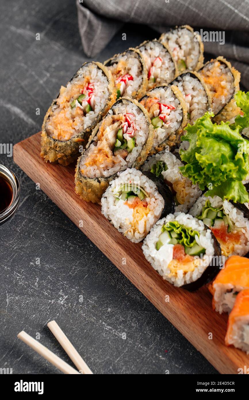 Side view sushi roll assorted set with soy sauce Stock Photo - Alamy