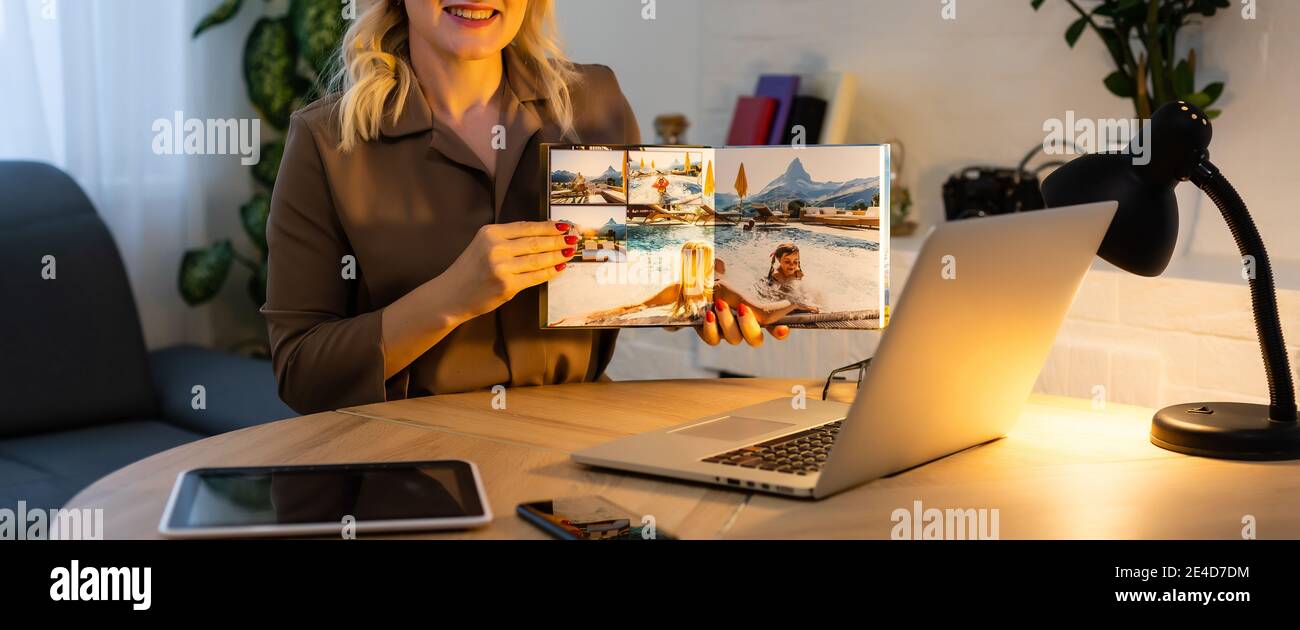 a woman holds square open family photobook, photo book. photo album ...